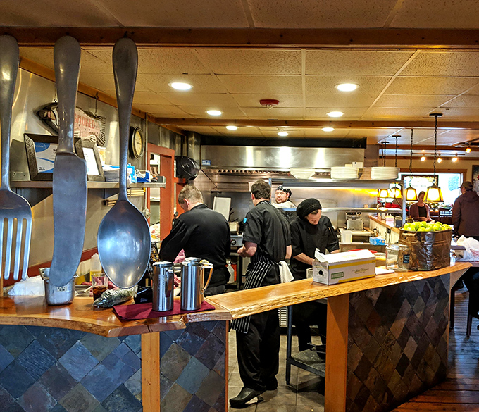 The kitchen crew moves with the choreographed precision of dancers who happen to create edible masterpieces instead of pirouettes.