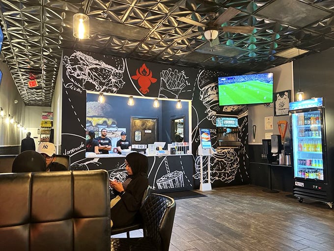 Sports on the screen, burgers on the table—this is what civilized society looks like at its finest hour.