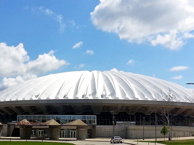 The distinctive dome of State Farm Center stands like a spacecraft that landed in corn country – an architectural icon visible for miles around.