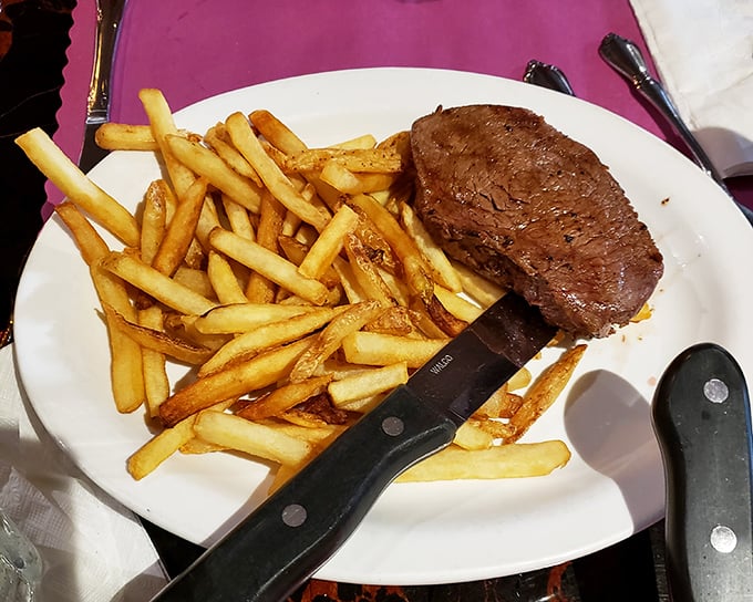 Golden fries that achieve that mythical balance—crispy exterior, fluffy interior—the perfect vehicle for soaking up steak juices.