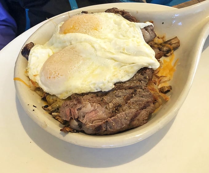 This skillet doesn't just contain breakfast—it tells a story of steak, eggs, and potatoes living harmoniously in a cast-iron neighborhood.