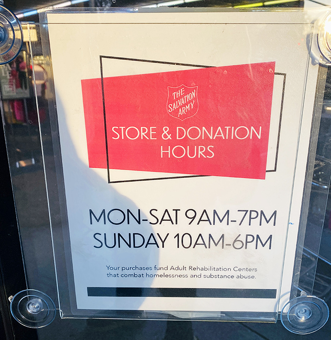 The store hours sign reminds shoppers that their treasure hunting funds a mission greater than bargains—community transformation happens here daily.
