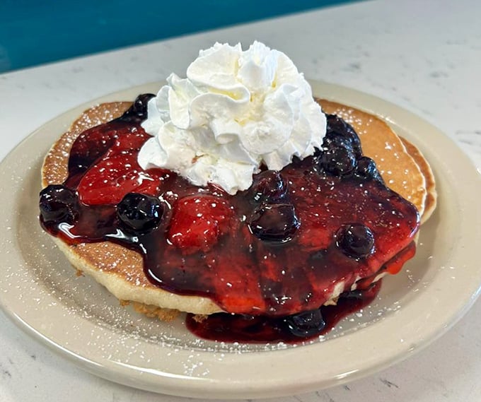 Pancakes crowned with berries and whipped cream – breakfast that's both Instagram-worthy and worthy of the inevitable food coma that follows.