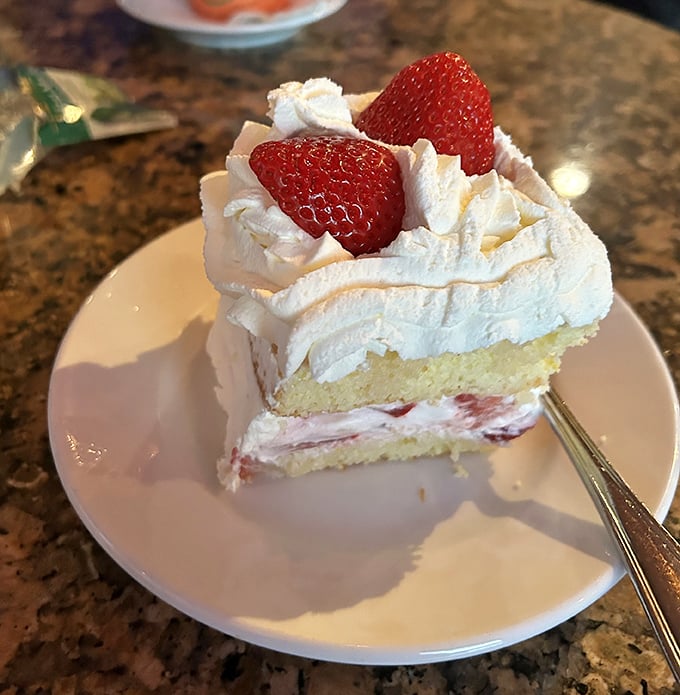 Strawberry shortcake that looks like it belongs in a Norman Rockwell painting – pure American comfort with Italian flair.