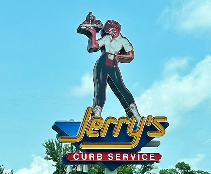 The vintage carhop signage stands tall against the sky—a nostalgic landmark that's outlasted countless food trends and fads.
