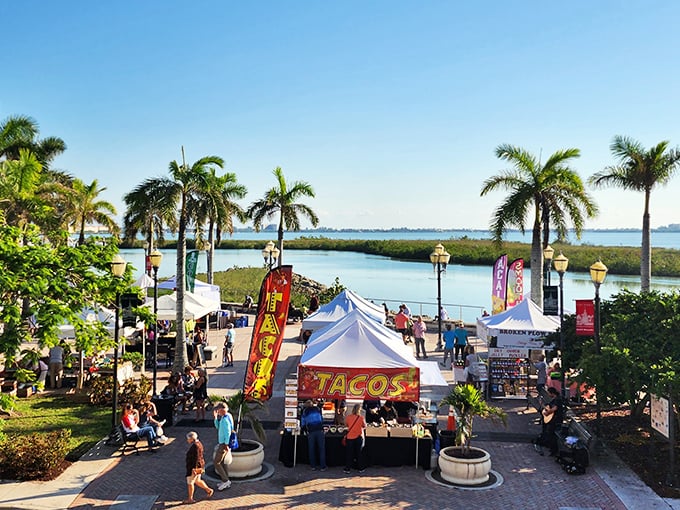The farmers' market transforms the waterfront into a festival of flavors, where "grocery shopping" becomes the day's main event.