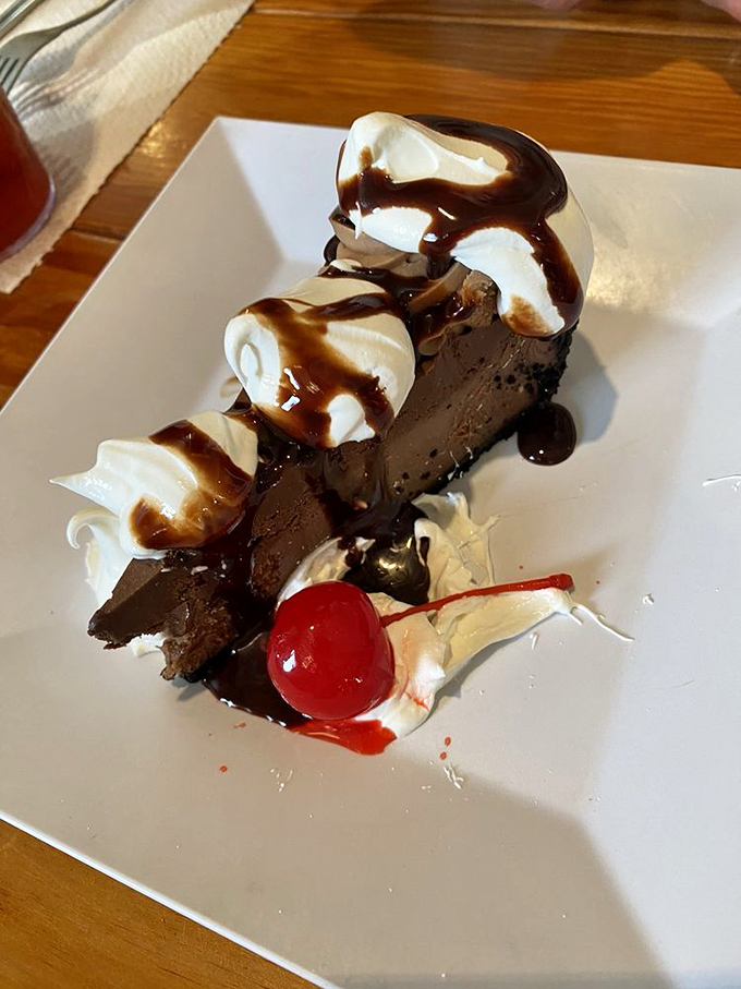 This chocolate dessert isn't just the final act of your meal—it's the standing ovation, complete with whipped cream applause and a cherry encore.