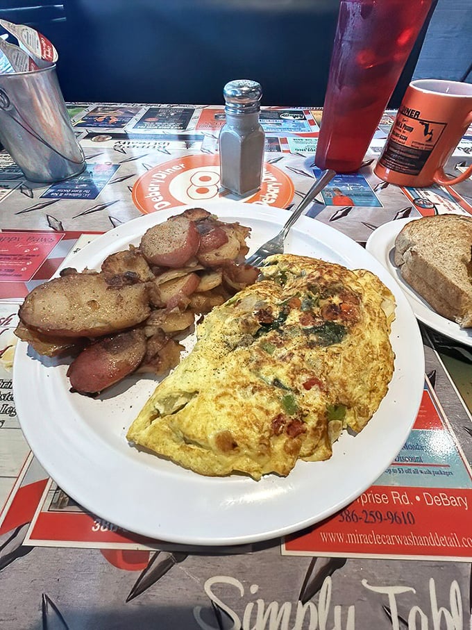 Veggie Omelet and Home Fries: Breakfast of champions—a fluffy omelet stuffed with veggies alongside potatoes that have achieved that perfect crisp-tender balance that home cooks dream about.