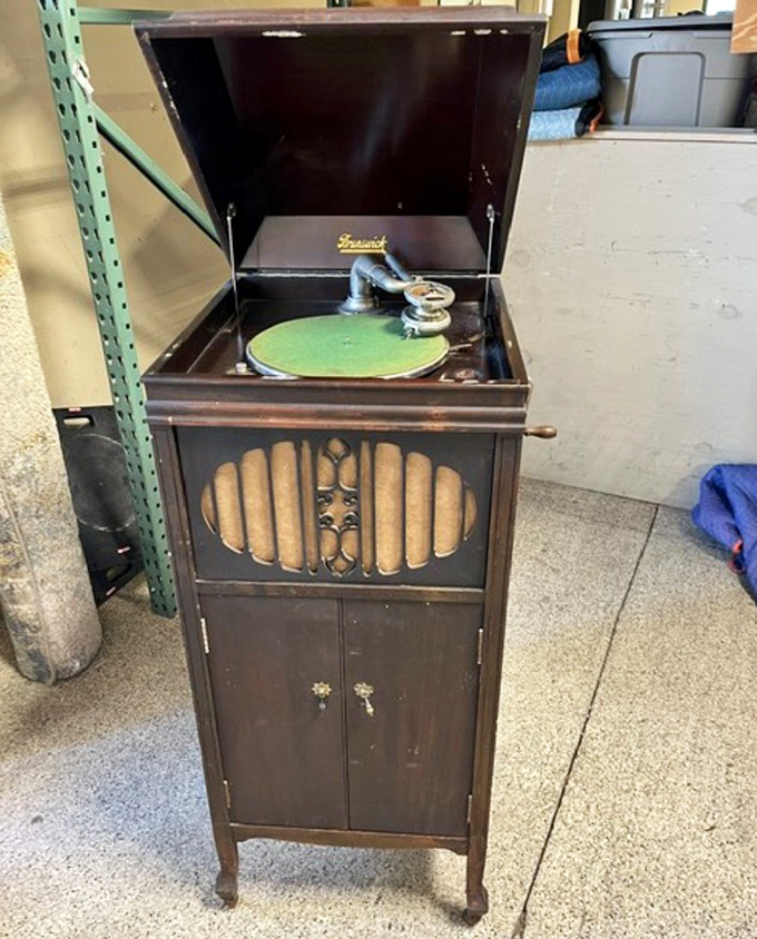 This vintage Brunswick Victrola isn't just furniture—it's a time machine. Wind it up and transport yourself to the Roaring Twenties.