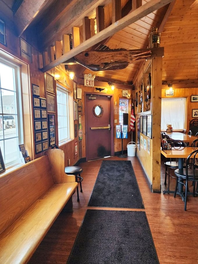 The entrance hallway isn't just a path to your table—it's the gangplank to your seafood adventure, complete with wooden charm.