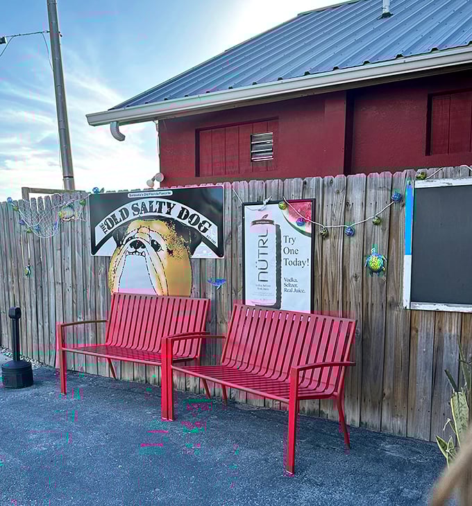 Red benches outside for the wait that's always worth it—like the anticipation before a great concert or your grandkid's graduation.