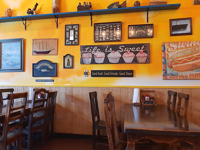 Wall décor that reminds you "Life is Sweet" alongside maritime memorabilia—a visual philosophy that perfectly captures Rusty's unpretentious charm.