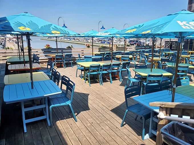 Blue chairs, blue umbrellas, blue water—it's like dining inside a perfect summer postcard that somehow also serves crab legs.
