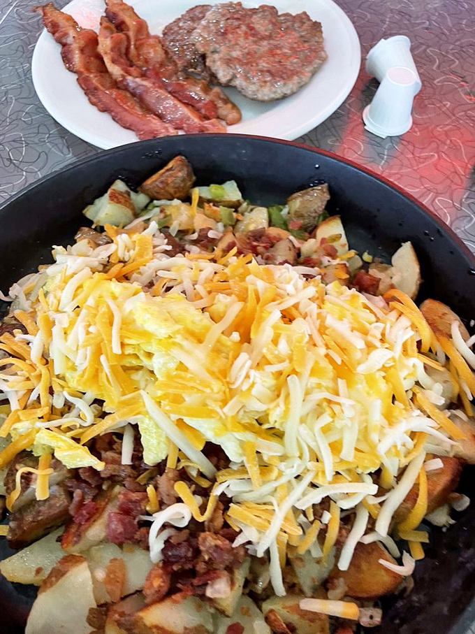 This isn't just breakfast—it's a masterpiece of morning engineering. Enough cheese to make Wisconsin nervous.