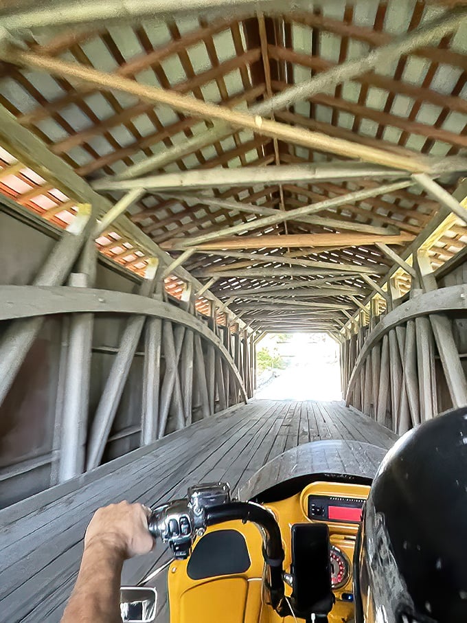 The view from behind the handlebars. Riding through a covered bridge creates a symphony of sounds as tires meet centuries-old wooden planks.