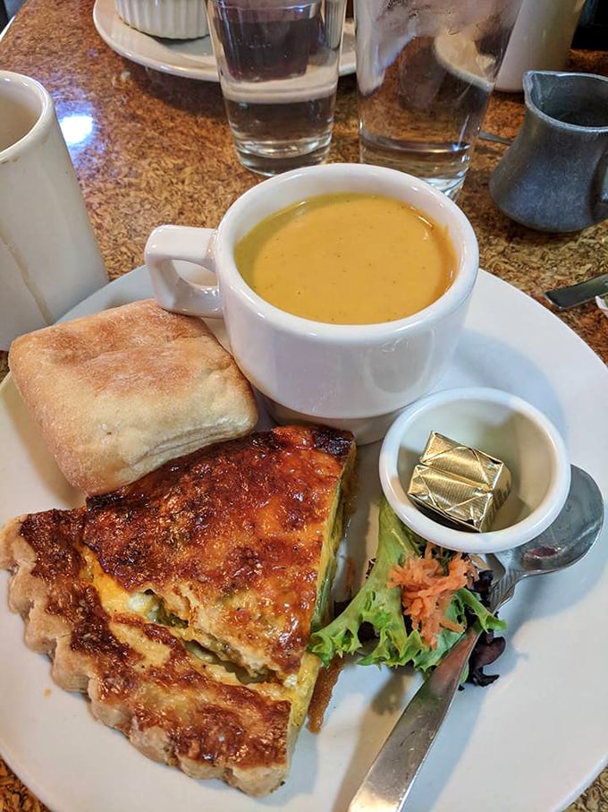Quiche that achieves the impossible—both substantial and delicate—paired with a bisque so velvety it could moonlight as a spa treatment.