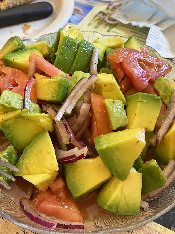 The avocado salad—a vibrant arrangement where each ingredient seems to be saying, "You're welcome" to your taste buds.
