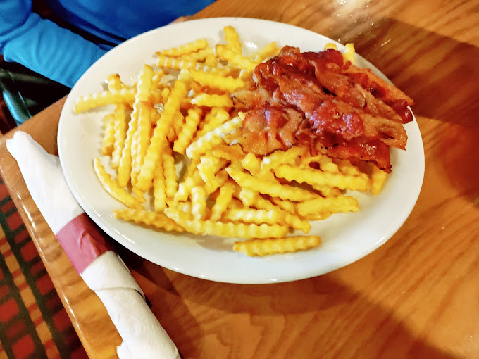 Crispy bacon and golden crinkle-cut fries—sometimes the simplest pleasures are the most satisfying, especially when done right.