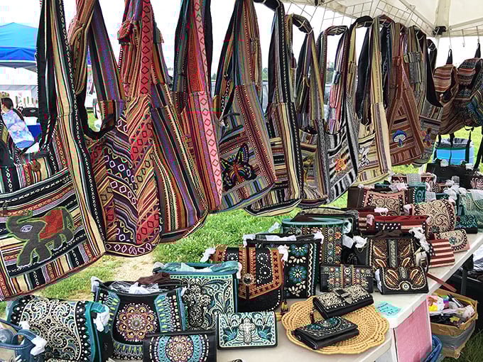 Handcrafted bags in vibrant patterns transform a simple table into an international bazaar of textile artistry and practical beauty.
