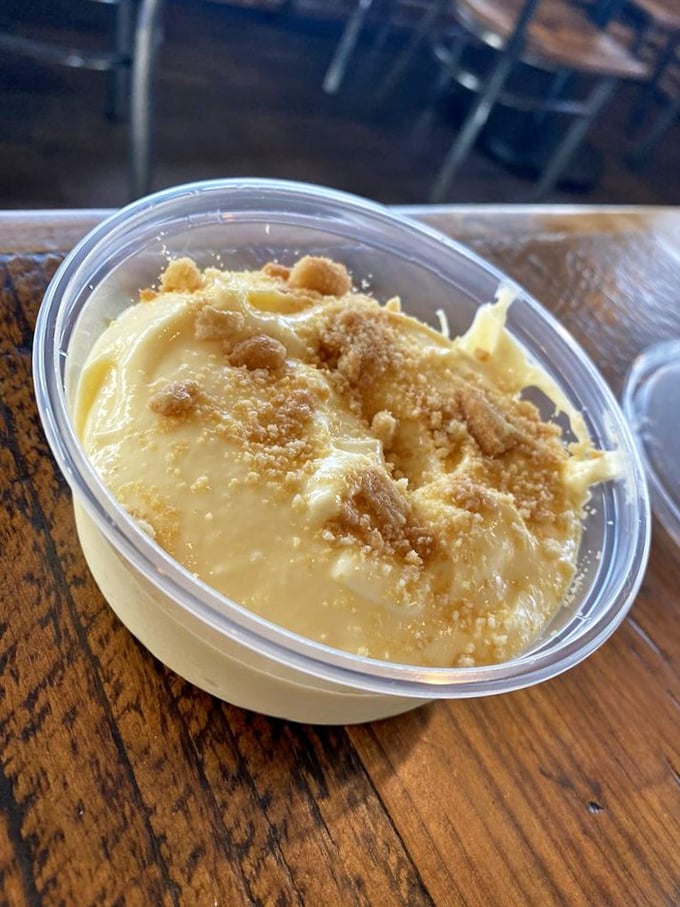Banana pudding that whispers sweet nothings to your taste buds—the creamy dessert finale that somehow finds room in your meat-filled stomach.
