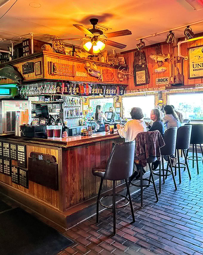 The bar where sea stories get better with each round. Those wooden walls have absorbed decades of laughter and tall fishing tales.