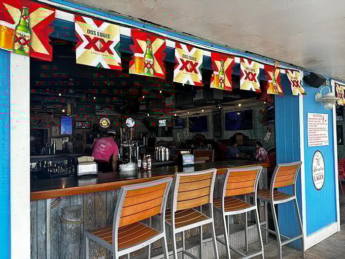 The outdoor bar, where Dos Equis banners flutter in the sea breeze and wooden barstools await those wise enough to know where the locals drink.
