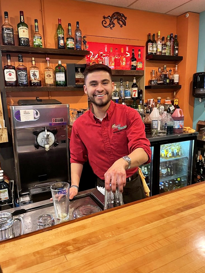 Behind every great Mexican restaurant is a bartender with the power to transform your Tuesday. That smile isn't just friendly—it's the prelude to your perfect margarita.