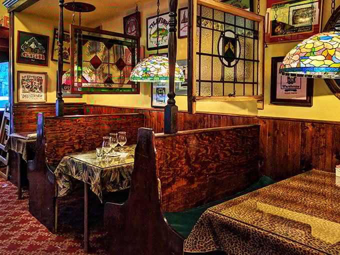 Cozy booths with stained glass accents offer intimate dining nooks. These wooden sanctuaries have hosted first dates, family celebrations, and countless "you've got to try this" moments.