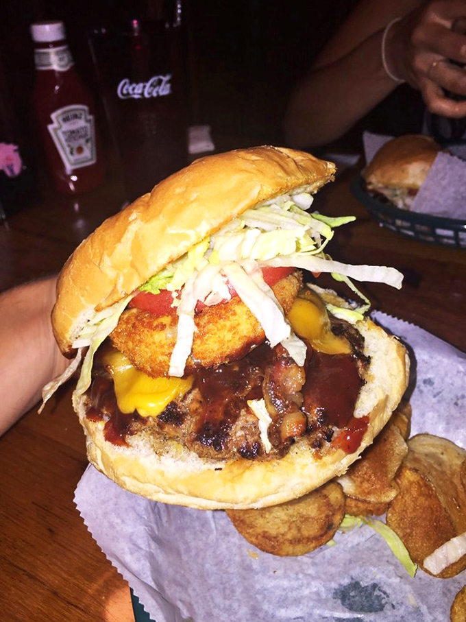 "Float like a butterfly, sting like a bee"—this burger would make Ali proud. Topped with a crispy onion ring and coleslaw, it's both elegant and powerful.