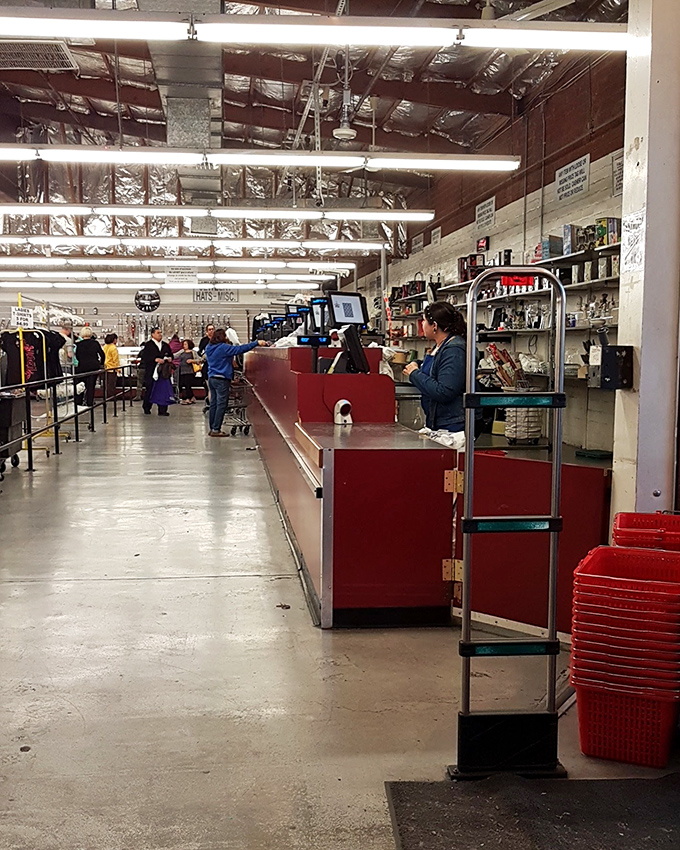 The checkout line: where treasure hunters exchange knowing glances, each cart filled with stories of "you'll never believe what I found for just..."
