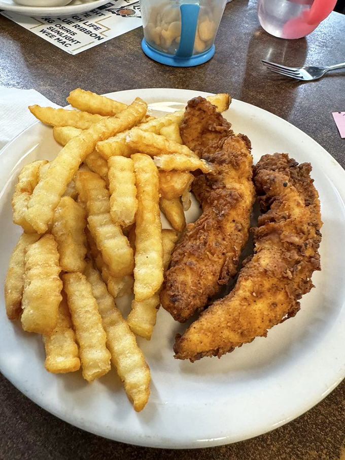 Chicken tenders and crinkle-cut fries – proof that sometimes the simplest pleasures are the most satisfying.