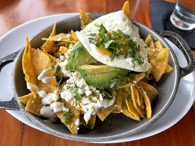 Chilaquiles that bridge cultures and satisfy cravings—topped with an egg that's just waiting for its Instagram moment.