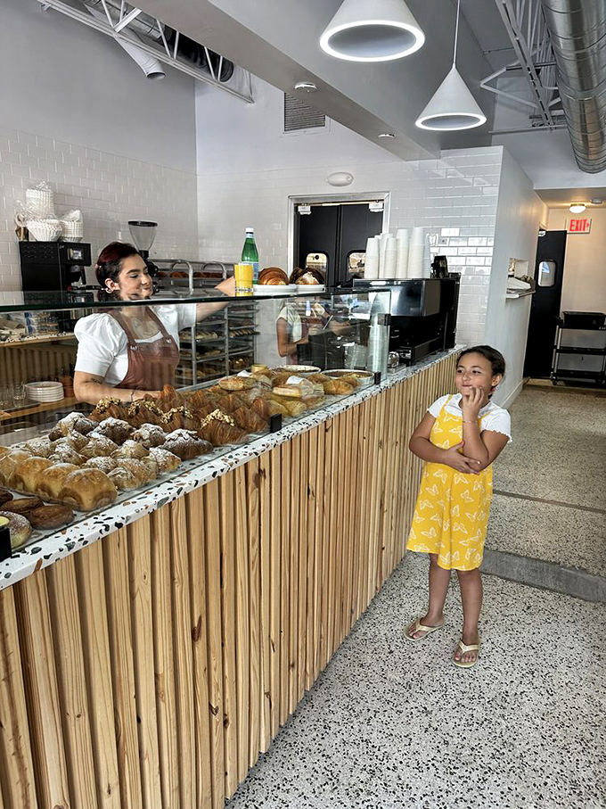 The universal language of bakery anticipation needs no translation – just the wide-eyed wonder of discovering your next favorite treat.