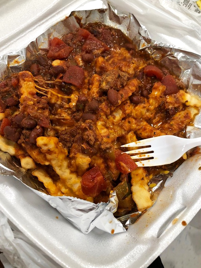 Chili cheese fries that don't mess around—a glorious mess of ground beef, beans, and melted cheese atop crispy potatoes. Fork required, no regrets allowed.