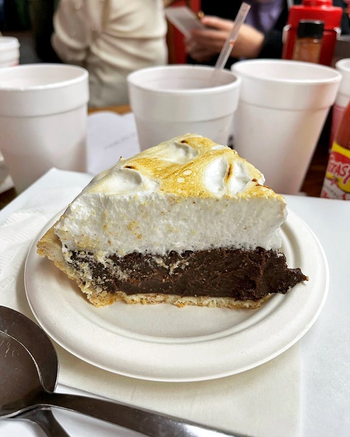 A slice of chocolate meringue pie that makes you question why you ever wasted stomach space on anything else.