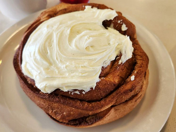 This cinnamon roll isn't playing around—it means business. That cream cheese frosting is making a statement that your diet plan can't ignore.