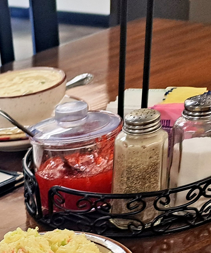 The condiment caddy—humble ambassador of customization. That homemade strawberry jam isn't just a spread—it's the secret weapon that elevates a simple roll to memorable status.