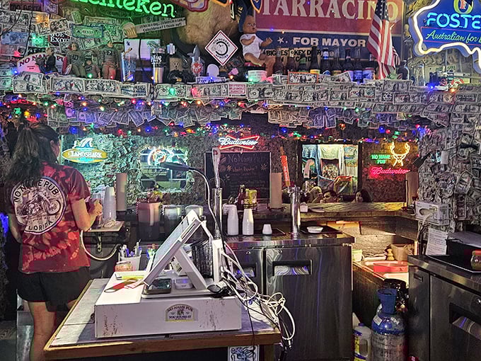 Behind this bar, magic happens—cocktails are crafted and stories are shared under a canopy of cash that's been accumulating for decades.