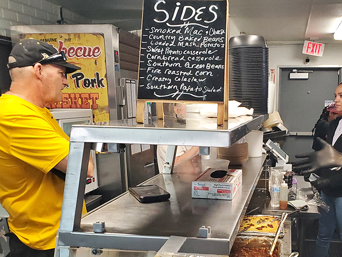 The chalkboard of sides reads like a southern comfort food manifesto. Smoked mac and cheese, country green beans, and cornbread casserole—no diet survives this list.