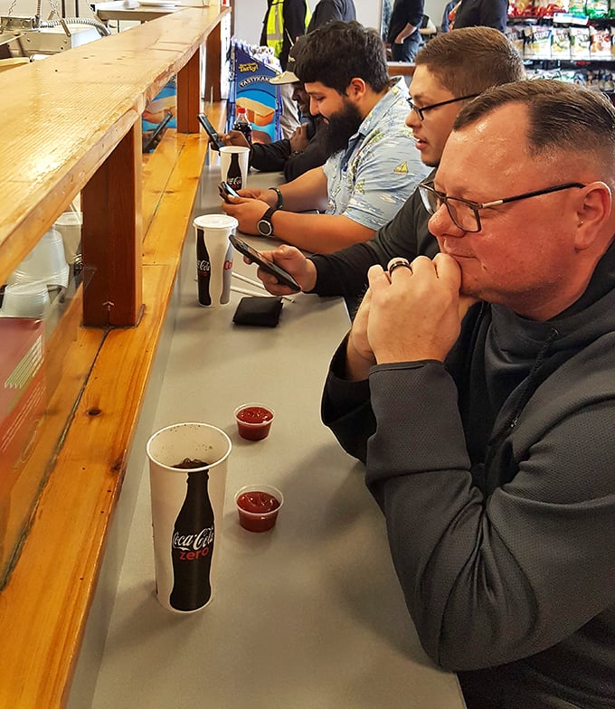 The universal language of sandwich appreciation. These diners know they've found something special at this Delaware gem.