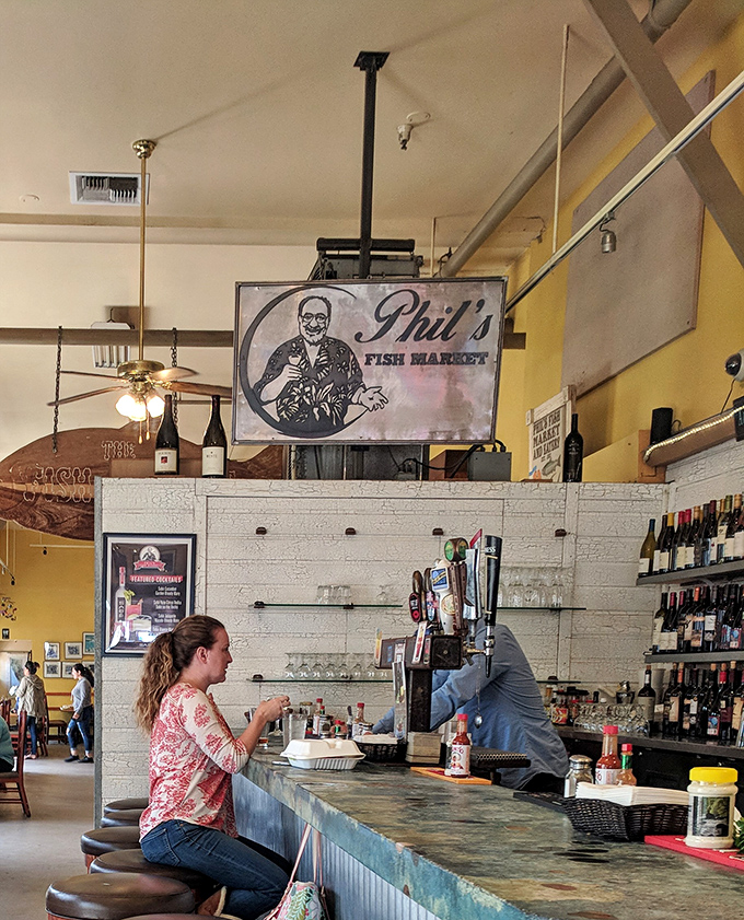 At the counter, where seafood dreams and reality meet. This is where the magic happens – orders placed, anticipation building, hunger growing.