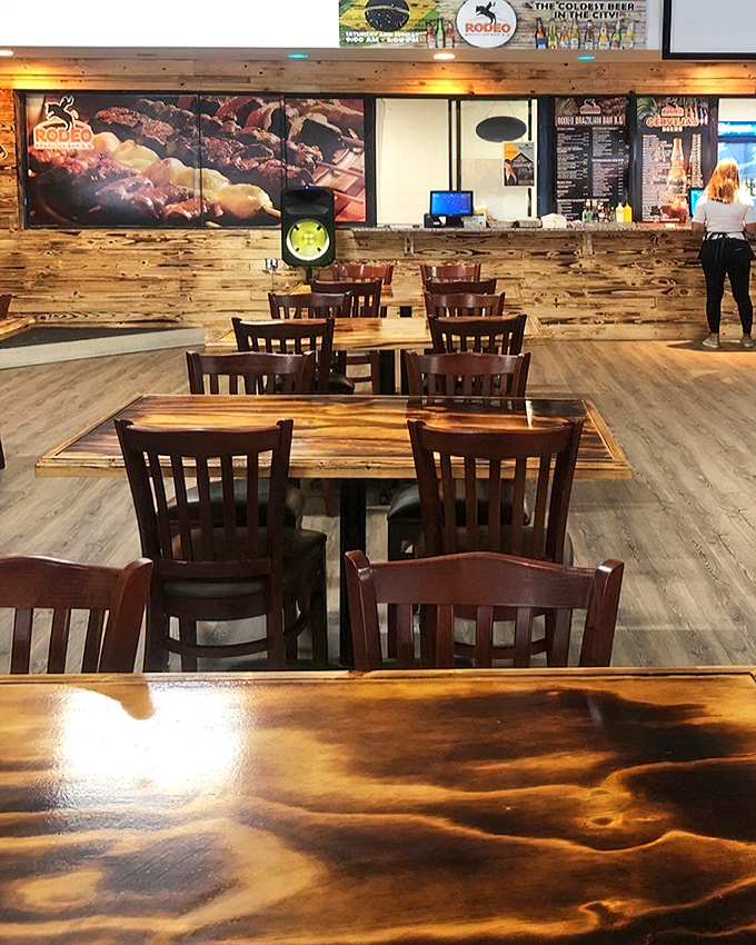 Rustic wooden tables and chairs create a dining oasis amid shopping adventures—the perfect pit stop for refueling hungry treasure hunters.