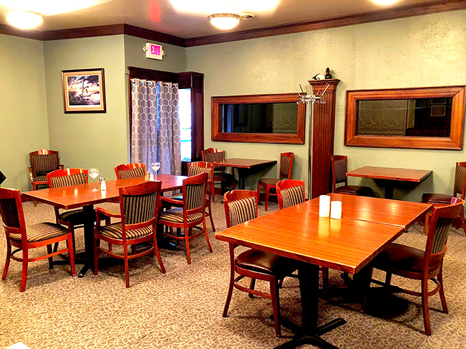 Tables awaiting their next happy customers. The warm wood and comfortable chairs invite you to settle in for an evening of culinary delight.