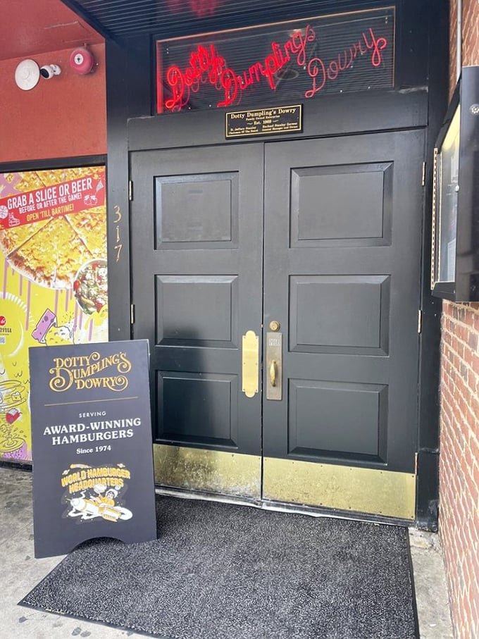 The entrance to burger paradise isn't pearly gates—it's these unassuming doors with a glowing red sign. Heaven is just a handle-pull away.