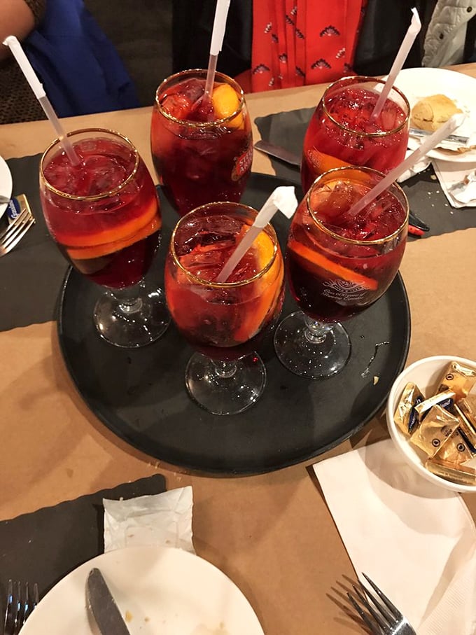 Sangria served in wine glasses the size of fishbowls—because sometimes your thirst requires more than a standard pour.