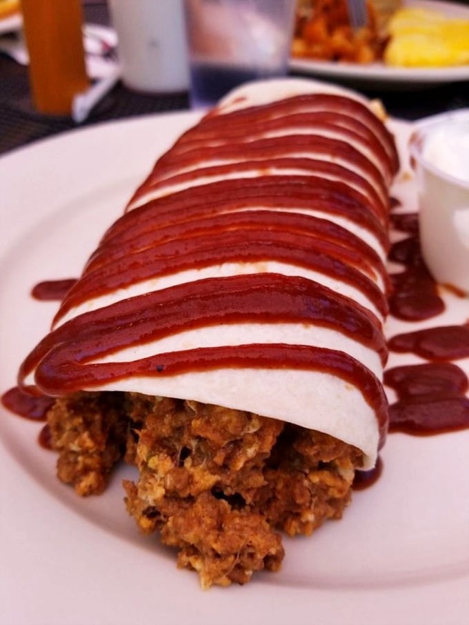This isn't just food—it's edible architecture, where layers of filling are lovingly wrapped and drizzled with sauce that makes you want to applaud.