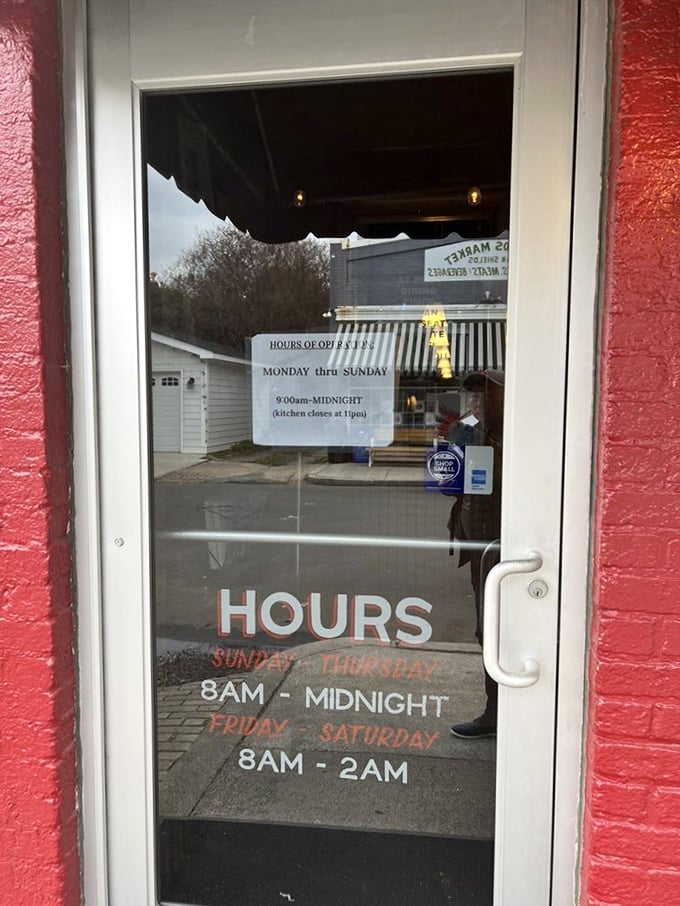 Even the door tells you everything you need to know – generous hours, clear expectations, and the promise of good things waiting inside.