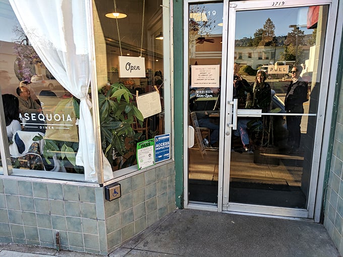 The "Open" sign—three simple neon letters that promise culinary salvation to the hungry masses lined up outside.
