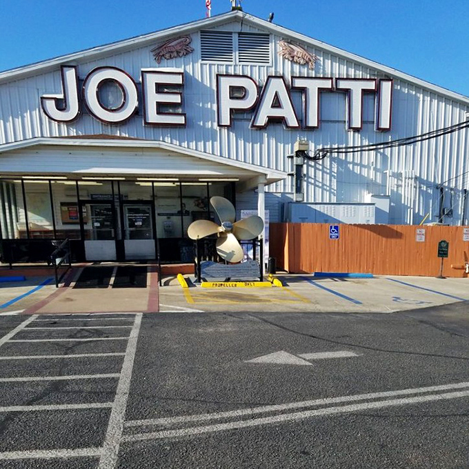 The entrance features a giant propeller—a not-so-subtle reminder that you're about to experience seafood with serious maritime credentials.