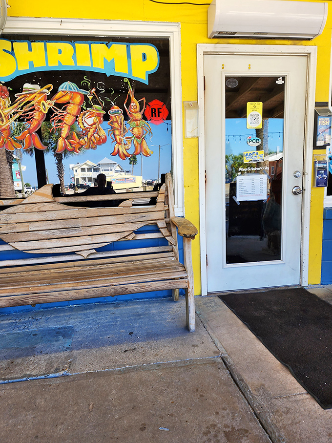 The entrance to Hunt's promises no pretense—just a bright yellow beacon guiding hungry travelers to seafood salvation.